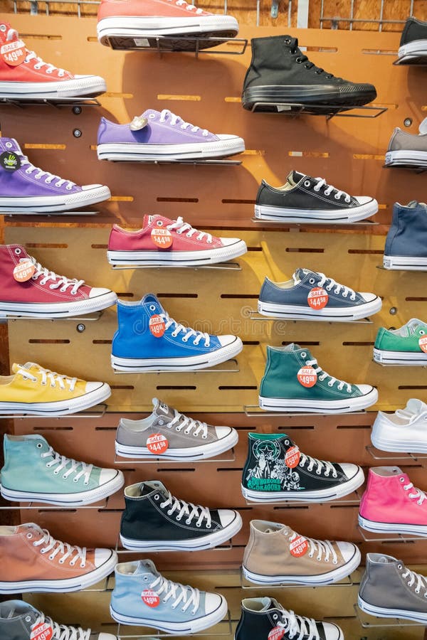 Sneakers of Different Colors and Sizes on the Sales Rack in the Store ...