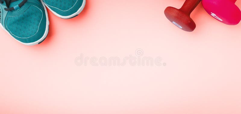 Sneakers and Dumbbells on the Solid Backdrop. Keep Fit Athletic and ...