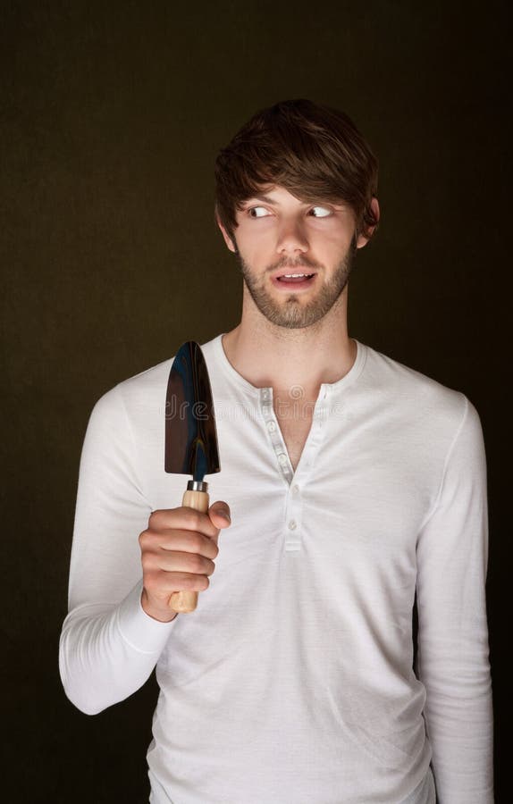 Sneaky Man Holding Trowel stock photo. Image of look - 19540410