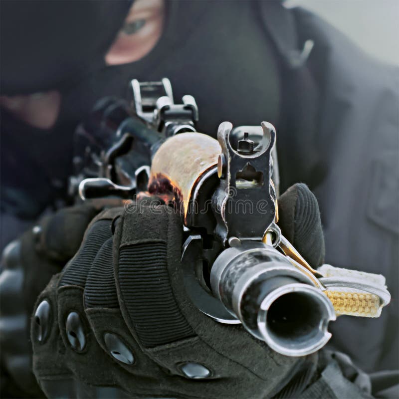 The Sniper Aims and Shoots. the Killer Holds a Submachine Gun Stock ...