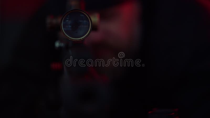 Sniper Looking through Scope on Rifle. Violent Man Making Shot from ...