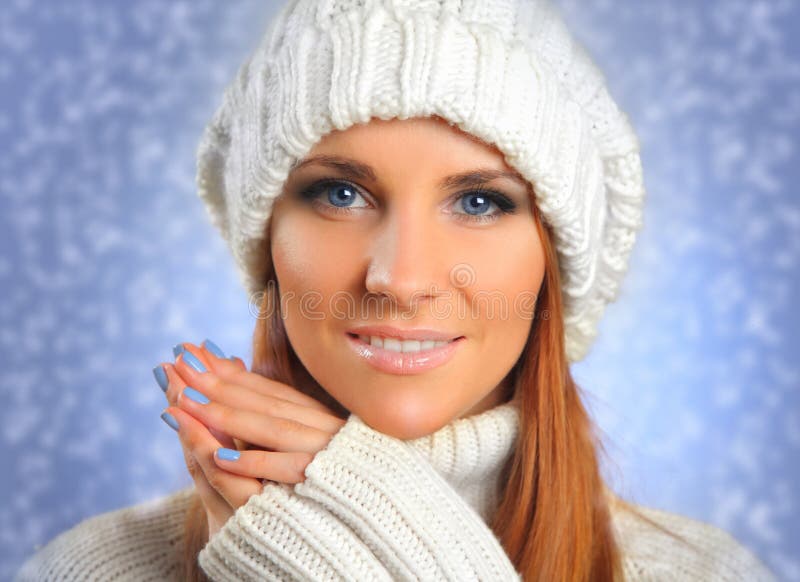 Snow, Beautiful young woman with white sweater and cap model