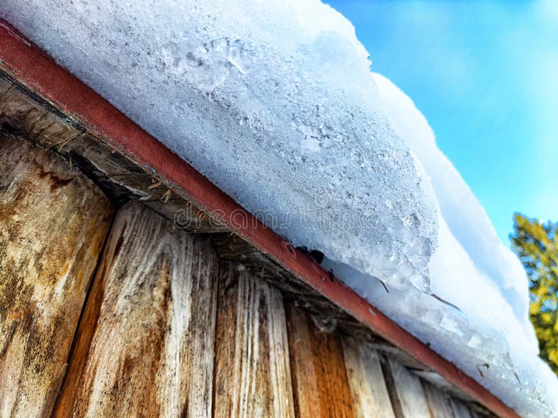Snow Accumulation at the Edge of a Roof Poses Risks during Winter and ...