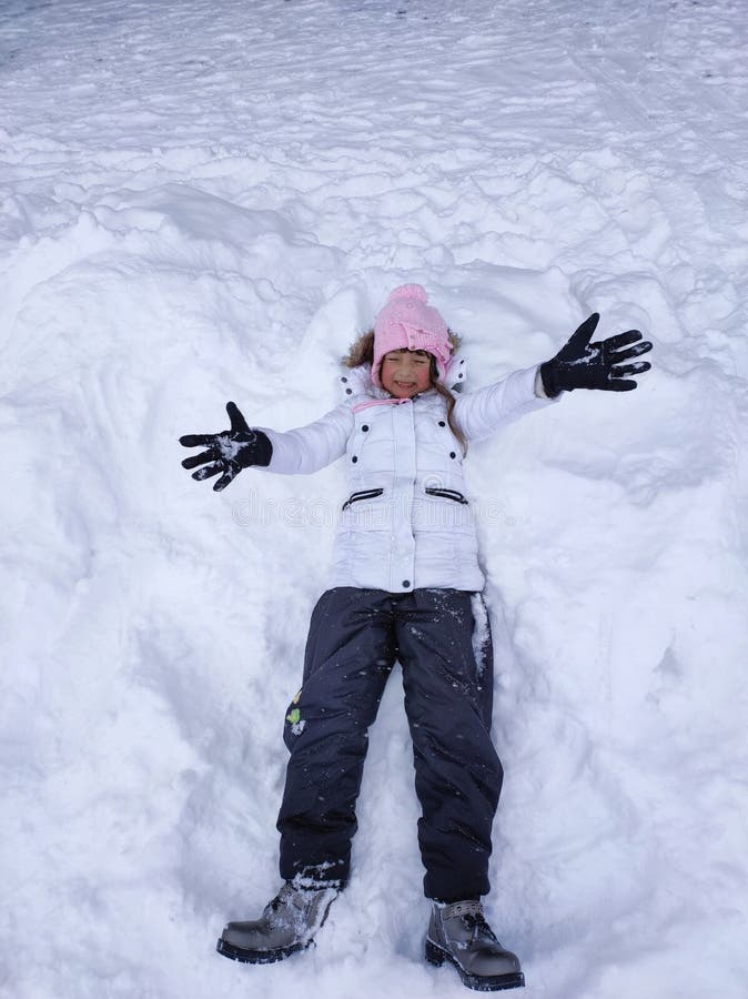 Snow angel stock photo. Image of young, laying, child - 332415308