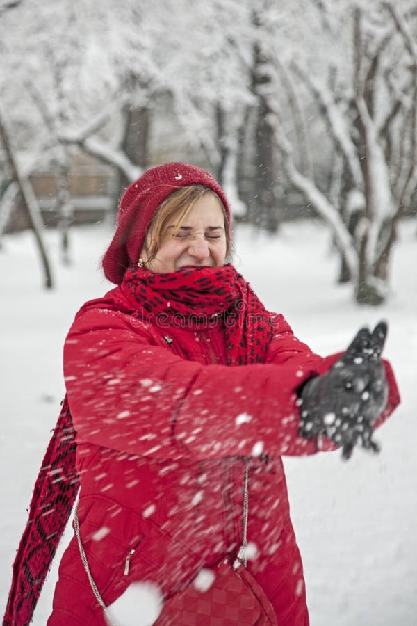 Young Woman Trying To Catch a Snowball Stock Image - Image of action ...