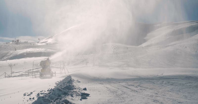 Snow Cannon in Operation at the Edge of a Ski Piste, during Winter ...