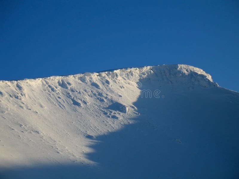 Mountain With Snow Cap Under Cloudy Sky At Daytime Picture. Image: 83064427