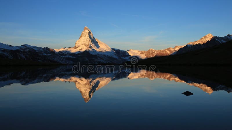 Snow Capped Mount Matterhorn Mirroring in Lake Stellisee Stock Image ...