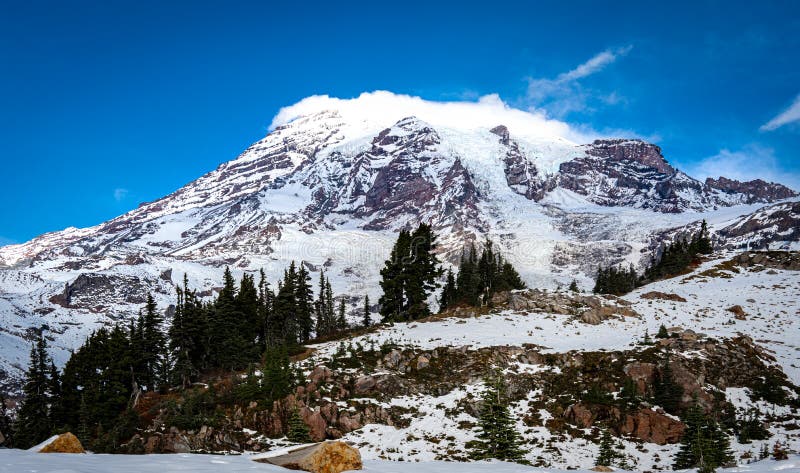 Snow-capped Mount Rainier with Blue Sky Stock Photo - Image of blue ...