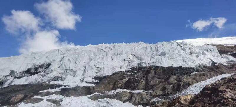 Snow-capped Mountain with Rocky Cliff Stock Photo - Image of pristine ...