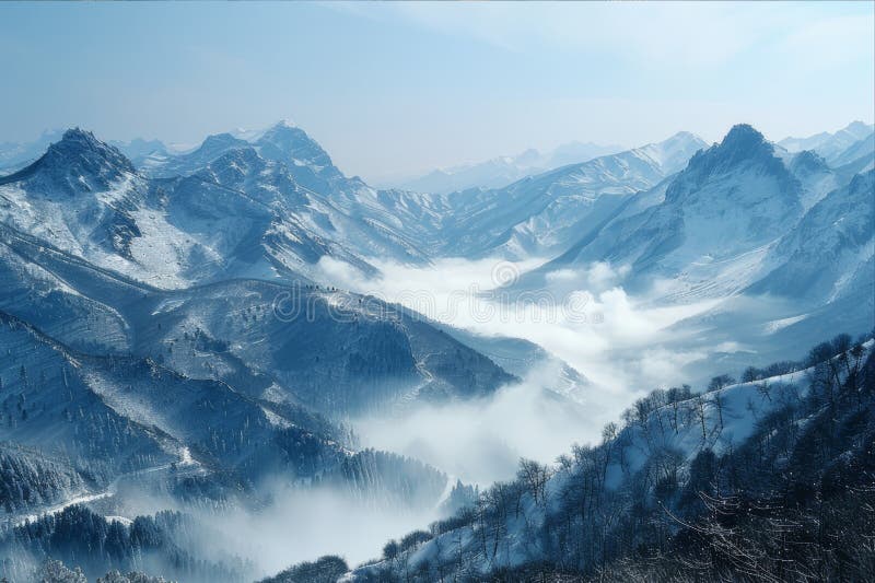 Snow-capped Mountains Fading into Mist, with a Lightly Clouded Sky ...