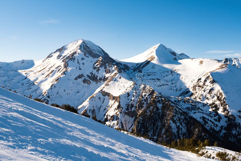 Snow-capped mountains stock photo. Image of capped, slope - 66828454
