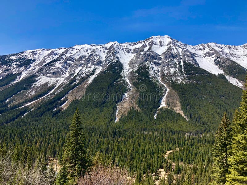 Snow Capped Mountains on a Sunny Day in Spring Stock Image - Image of ...