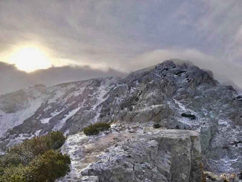 A Snow Capped Rock for Climbing Up Stock Image - Image of range, rocks ...