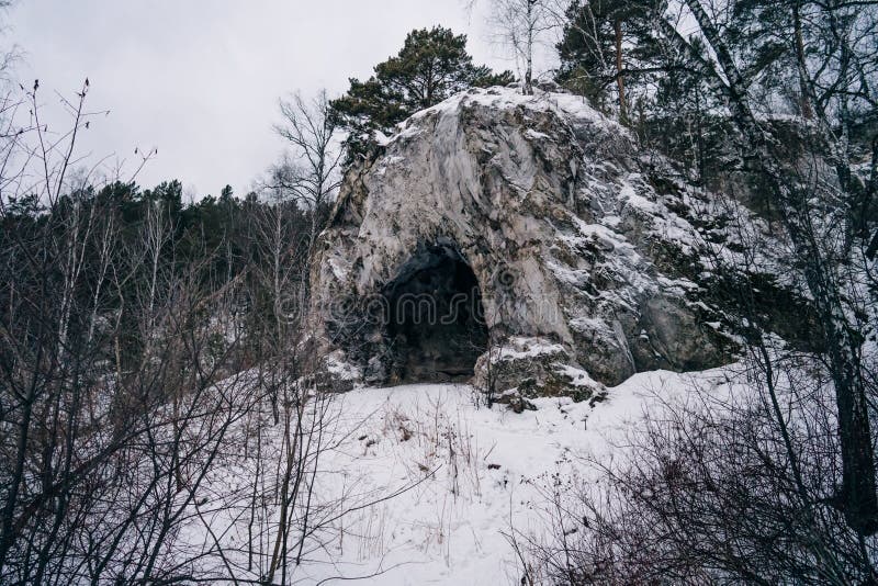 Snow cave in the forest stock image. Image of exploration - 239359027