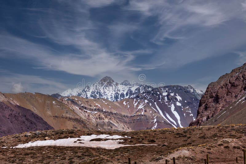 Snow-covered Andes Mountains Under a Cloudy Sky in Argentina Stock ...