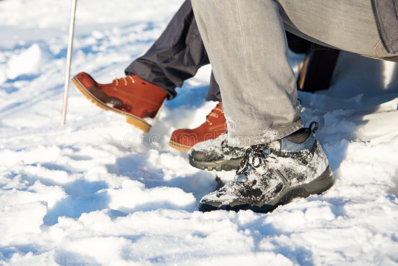 Snow Covered Boots and Hiking Stick Stock Image - Image of pair, legs ...