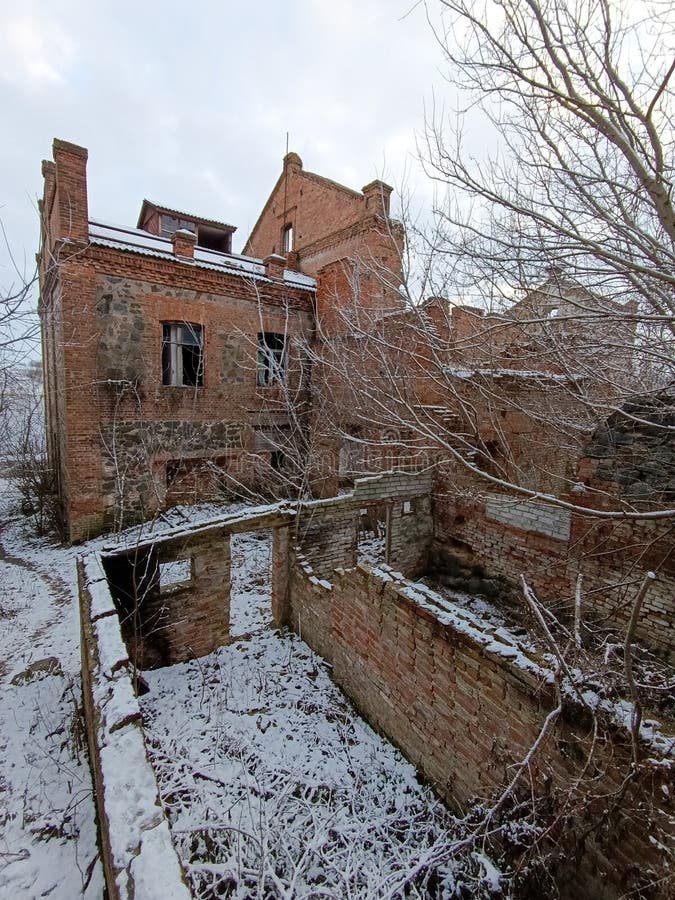 A Snow Covered Brick Building with a Tree in the Foreground Stock Image ...