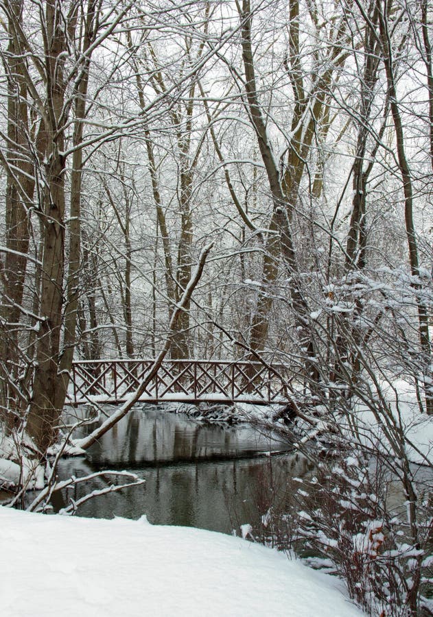 Snow Covered Bridge Over Creek Stock Image - Image of refelction ...