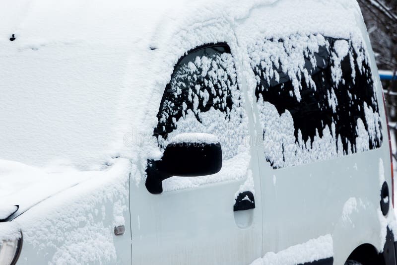 Snow Covered Car during a Blizzard. Difficult Weather Conditions in ...