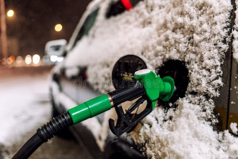 Snow Covered Car Refueling at the Gas Station Stock Image - Image of ...