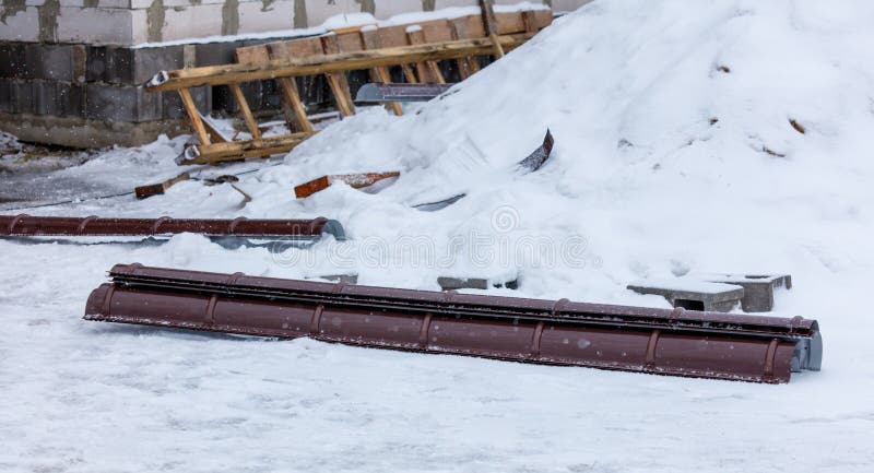 A Snow Covered Construction Site with a Large Piece of Equipment Stock ...