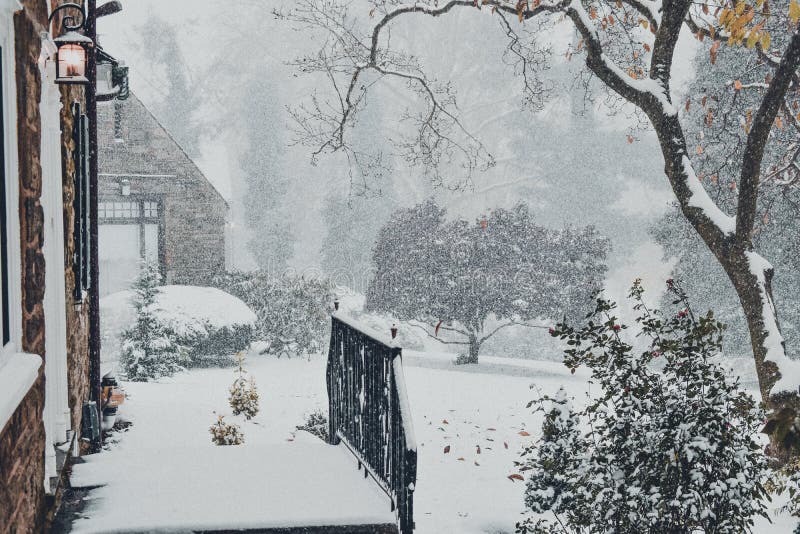 A Snow Covered Entryway To a Large Suburban Home Stock Photo - Image of ...