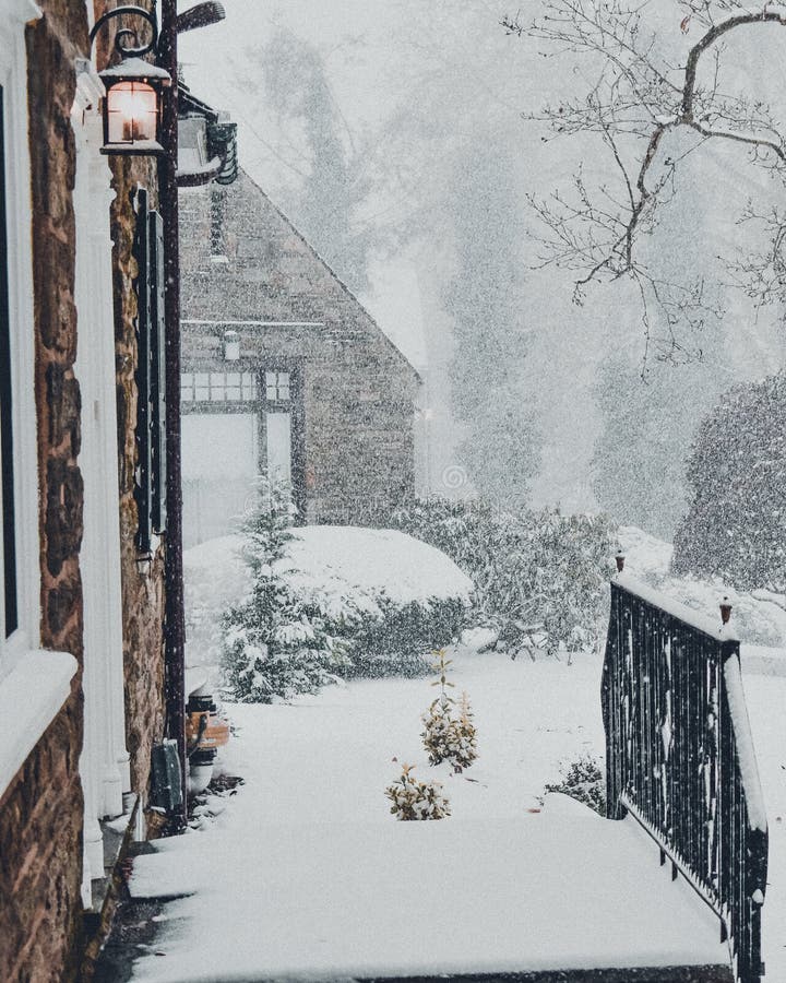 A Snow Covered Entryway To a Large Suburban Home Stock Image - Image of ...