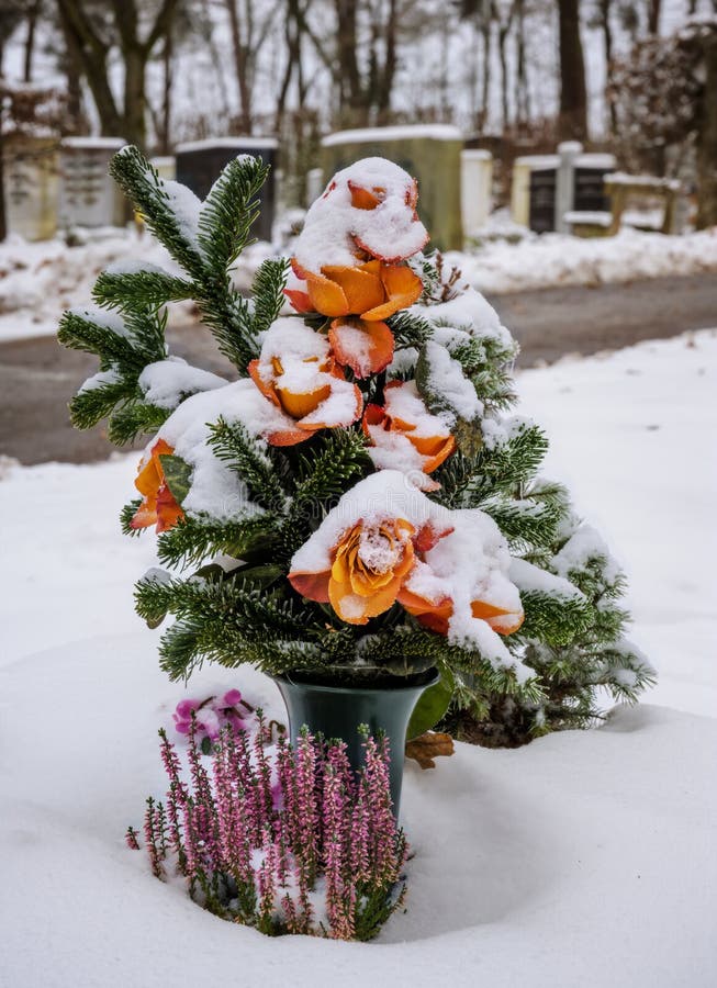 Snow Covered Flower Arrangement at the Cemetery Stock Photo - Image of ...