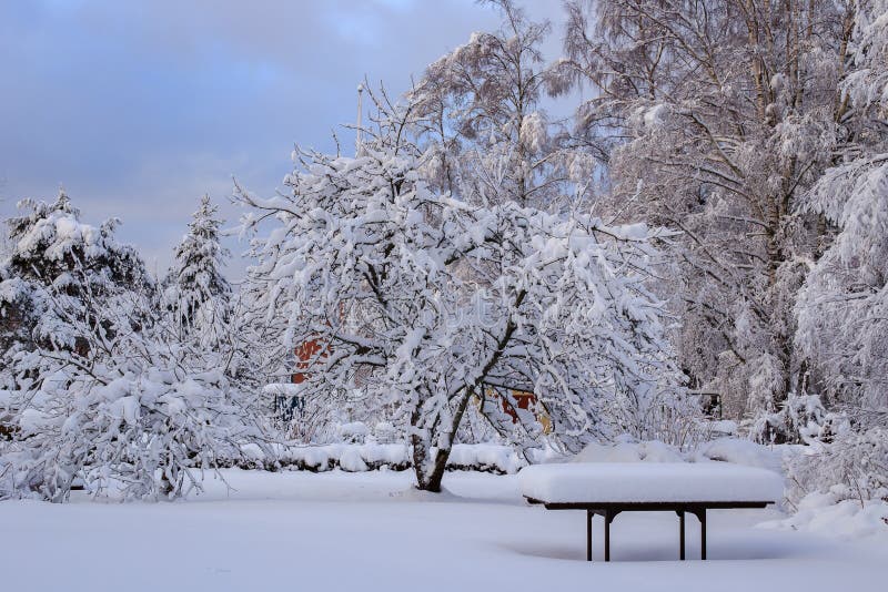 Snow covered garden table stock image. Image of seasonal - 62942263
