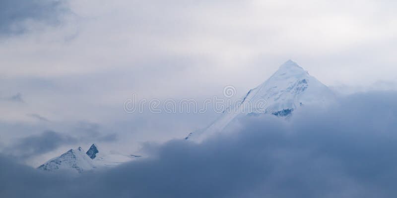 Snow Covered Himalayan Mountain Peak in a Cloudy Overcast Day Stock ...