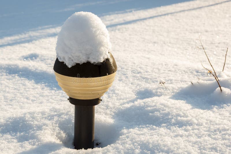 Snow covered lamp post stock image. Image of nature, lantern - 65510037