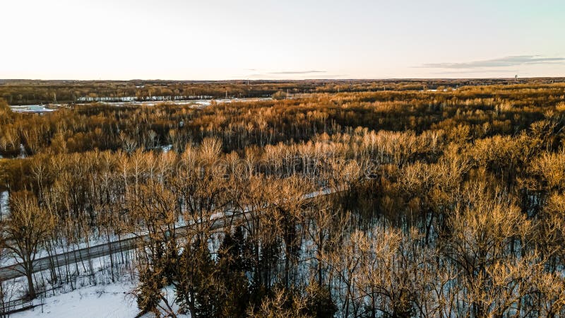 Snow Covered Landscape with Sunset Lighting Up Trees Stock Image ...