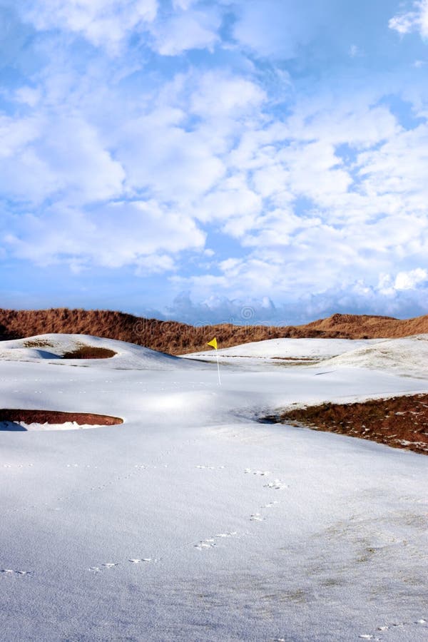 Snow Covered Links Golf Course with Yellow Flag Stock Photo - Image of ...