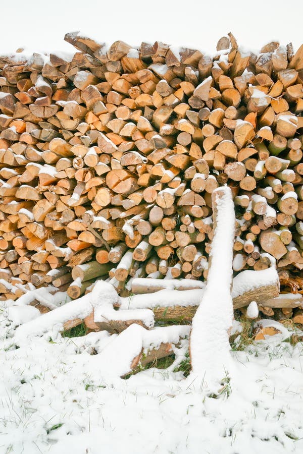 Snow-covered log pile stock image. Image of chop, frost - 97874053
