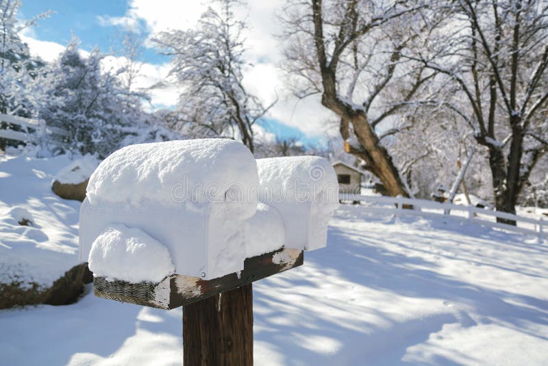 Snow Covered Mailboxes 01 stock image. Image of cloud - 83665209