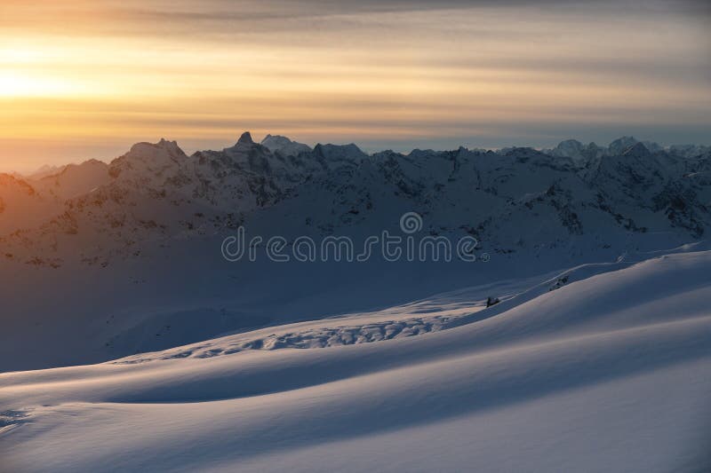 Snow-covered Mountain with Golden Snow from the Sun. the Mountain Range ...