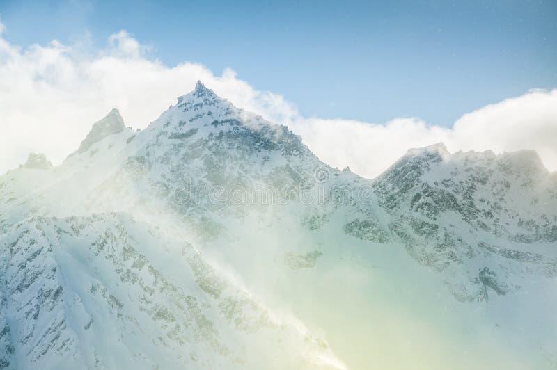 Snow-covered mountains stock photo. Image of mountains - 61157532