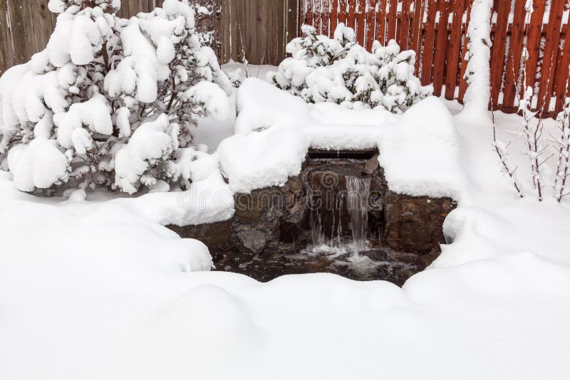 Snow Covered Outdoor Water Feature Stock Image - Image of family ...