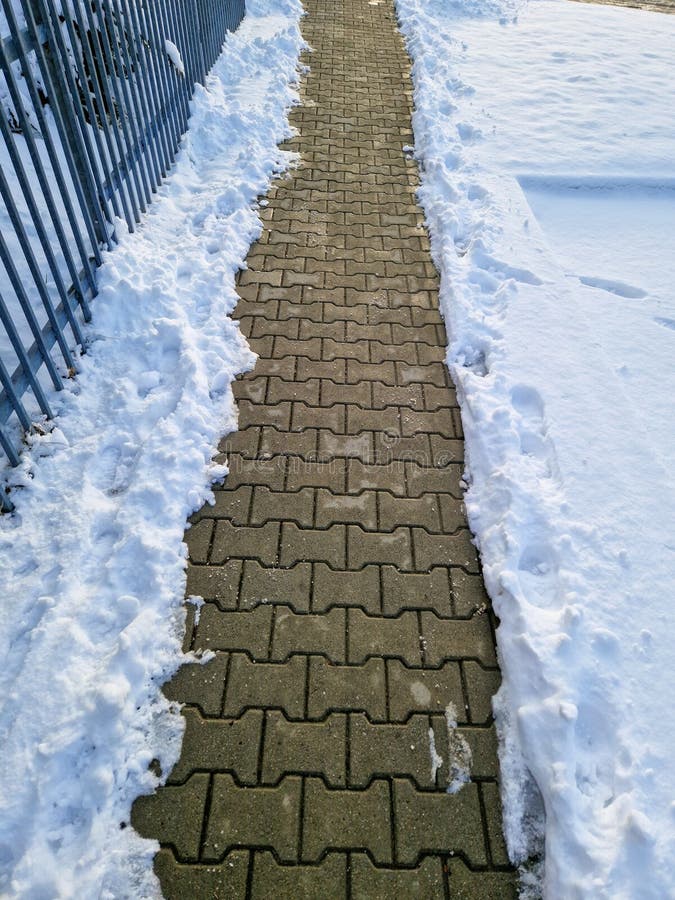 Snow-Covered Path Cleared for Walking Stock Image - Image of path ...