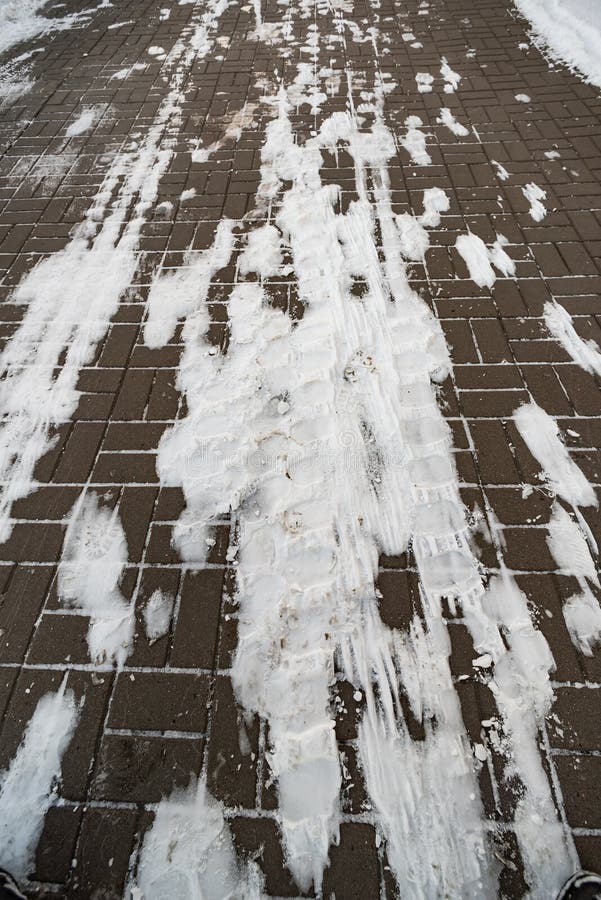 Snow covered pavement. stock image. Image of snowfall - 138777951