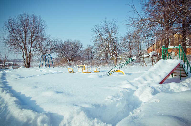 Snow-covered playground. stock photo. Image of colorful - 66406370