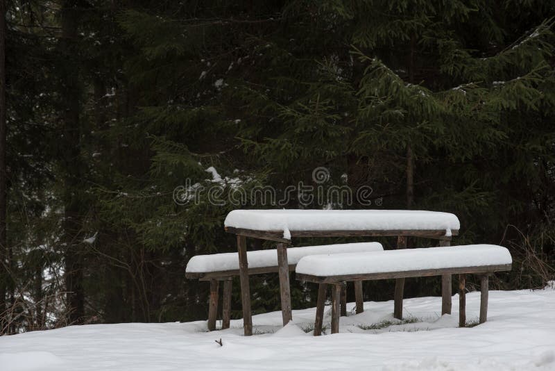 Snow Covered Resting Place with Table and Benches Stock Image - Image ...