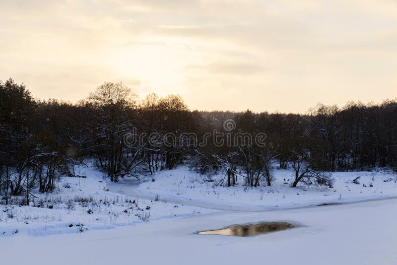 Snow-covered River at Sunset Stock Image - Image of sunset, orange ...