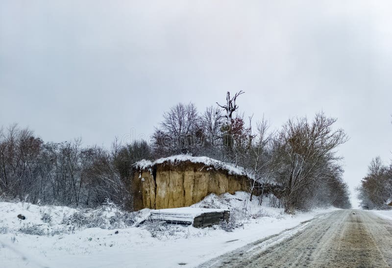 A Snow Covered Road with a Building in the Middle of it Stock Photo ...