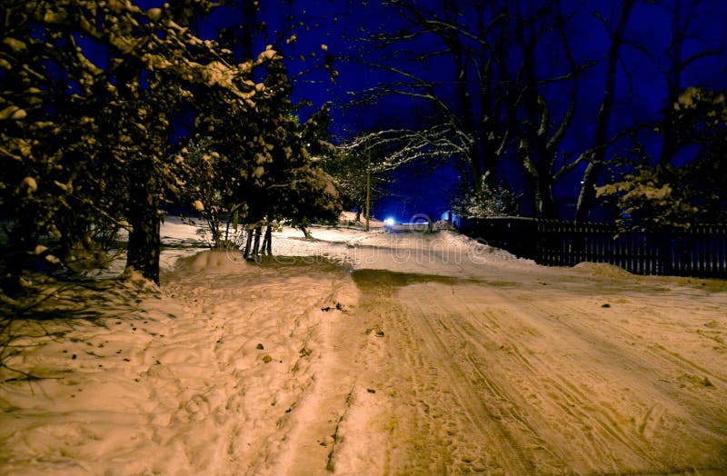 Snow covered road at night stock photo. Image of covered - 80733936