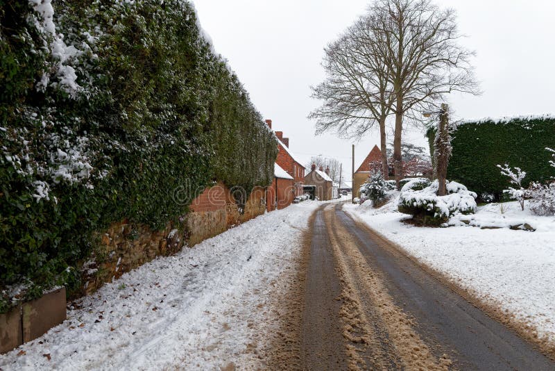 Snow covered road through stock image. Image of january - 105784609