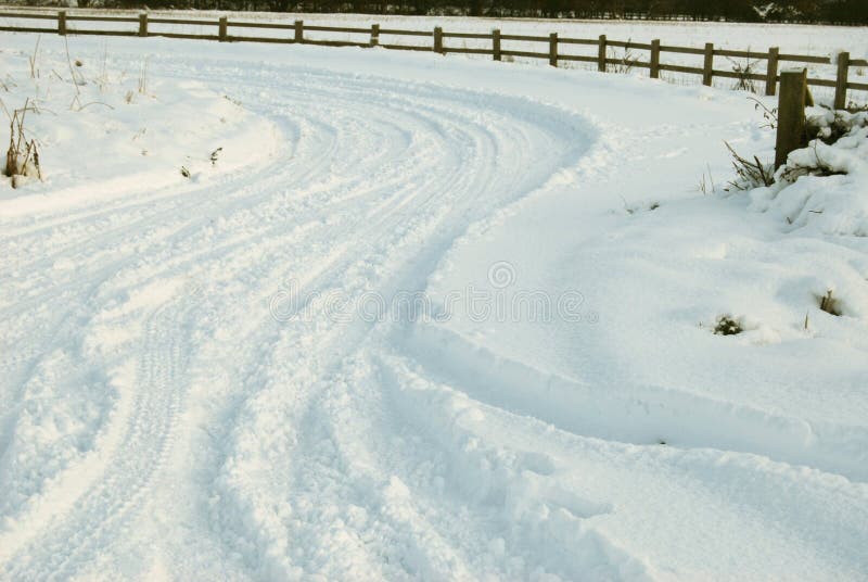 Snow Covered Road with Tire Tracks Stock Image - Image of road, snow ...