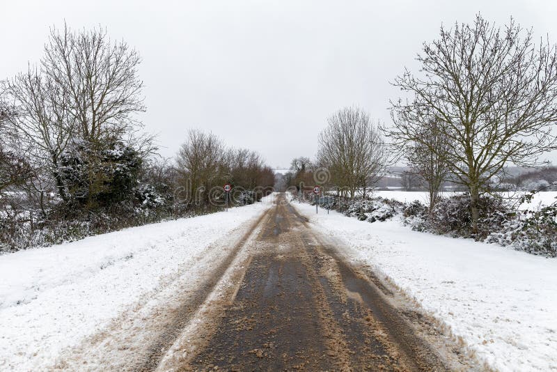 Snow covered road stock photo. Image of season, rural - 105784000