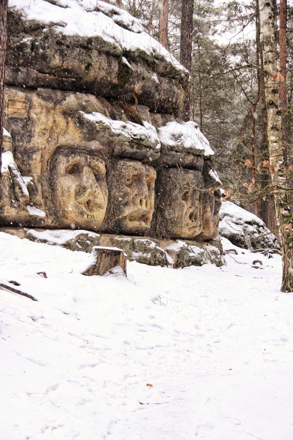 Snow Covered Rock with Engraved Faces Stock Photo - Image of monument ...